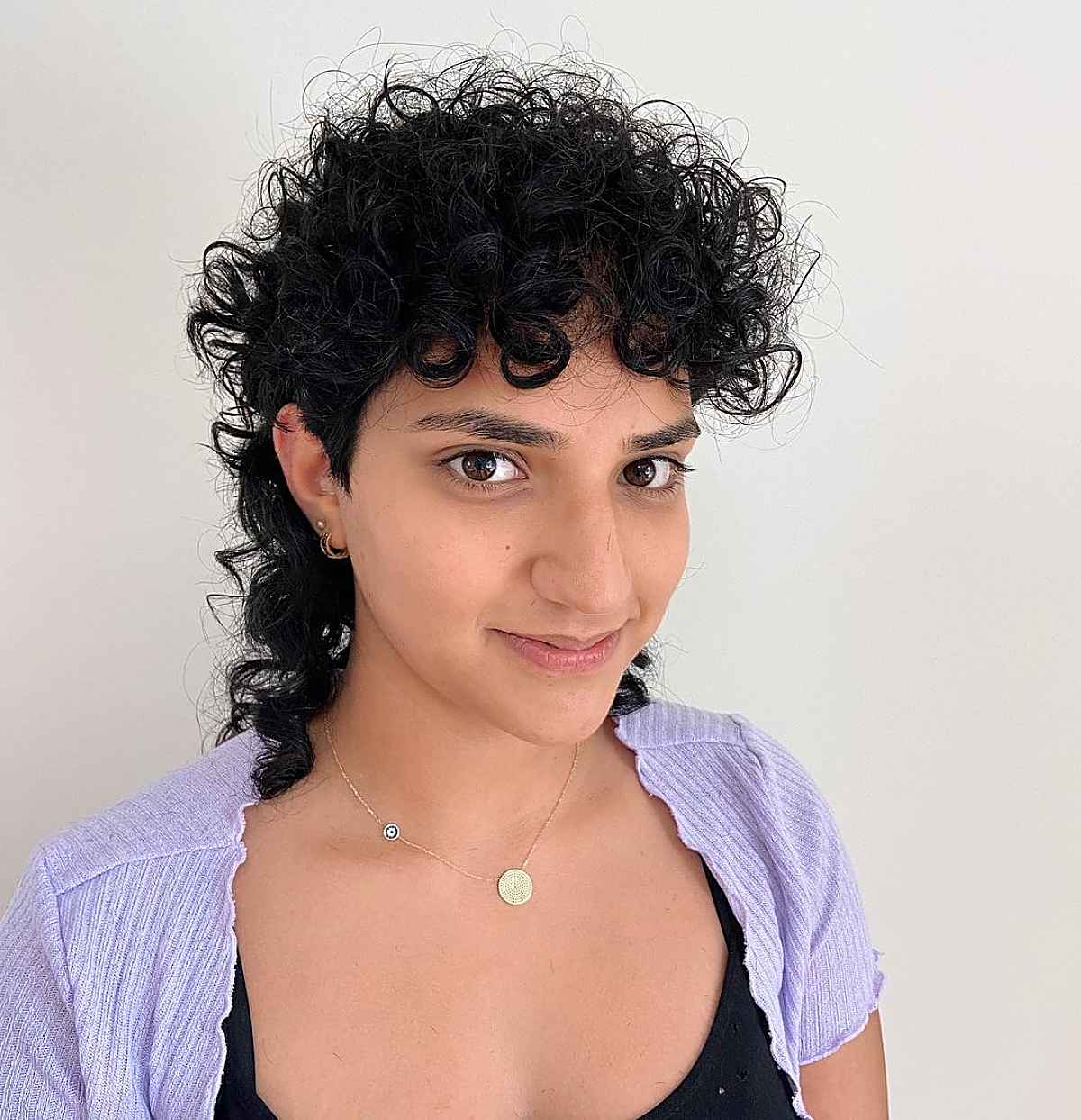 25+ Modern Curly Mullet Hairstyles for Girls in 2025 - Taper Fade